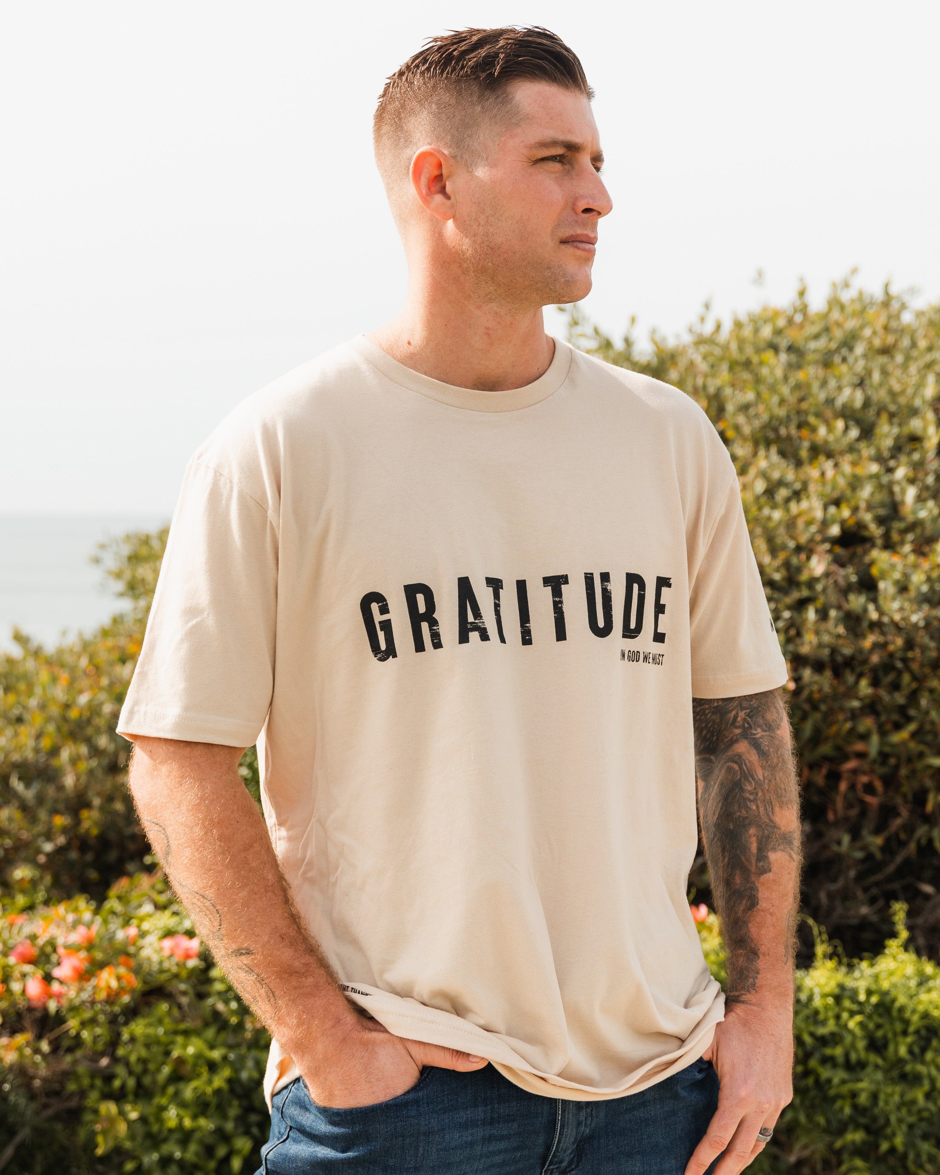 Gratitude Sand Tee – In God We Must